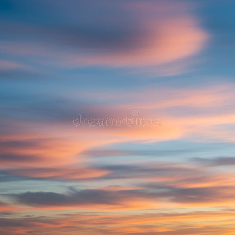 Soft, Wispy Clouds Diffuse Pastel Hues of Pink, Purple, and Orange ...