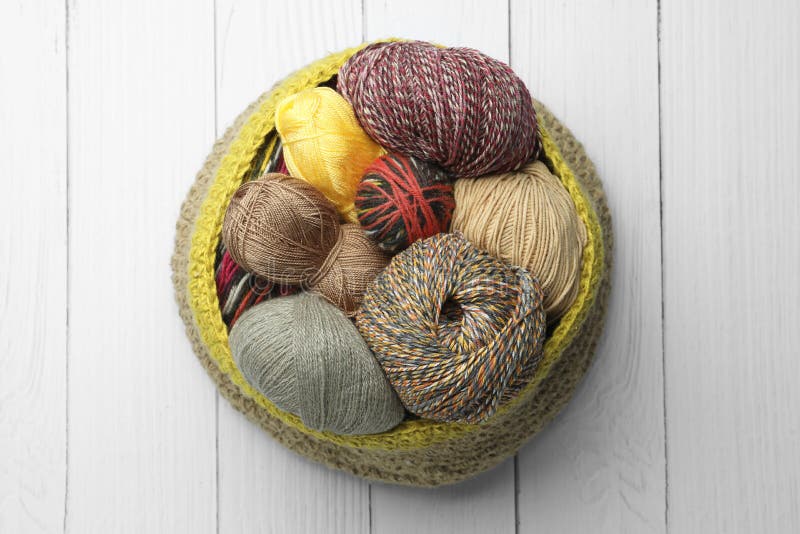 Soft Woolen Yarns on White Wooden Table, Top View Stock Photo - Image ...