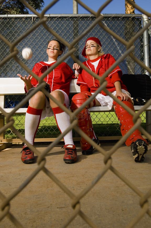 Softball Players Sitting on Bench Stock Image - Image of recreation ...