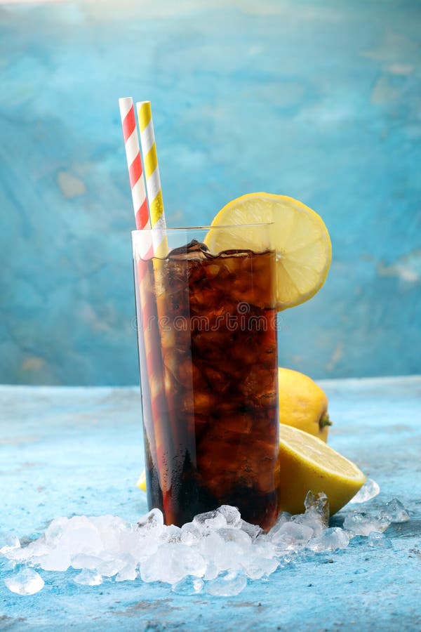 Softdrink with Ice Cubes, Lemon and Straw in Glass. Stock Image - Image ...