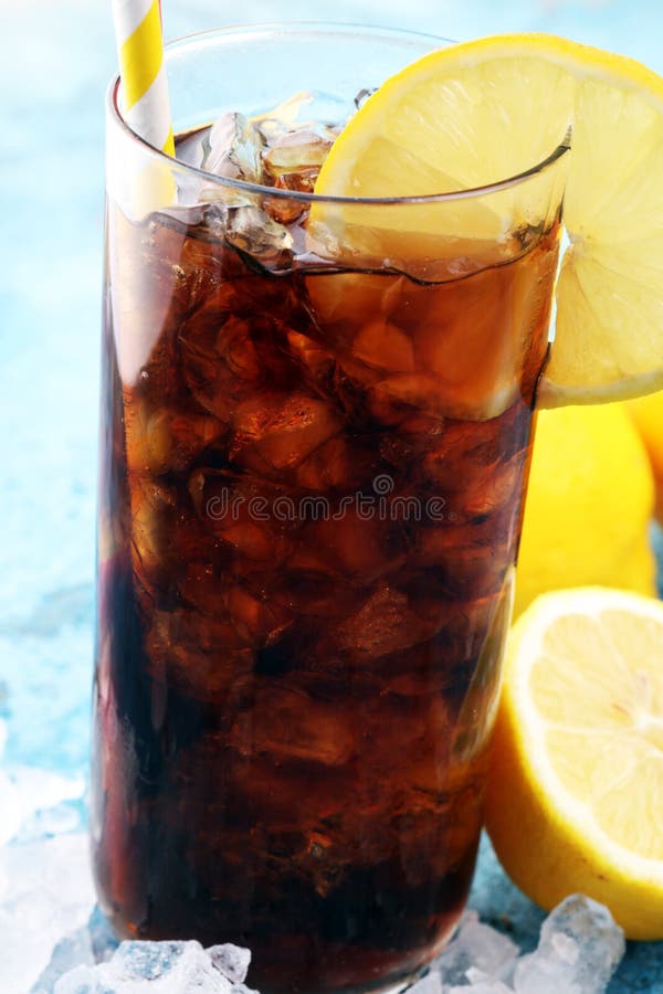 Softdrink with Ice Cubes, Lemon and Straw in Glass. Stock Image - Image ...