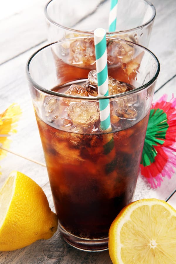 Softdrink with Ice Cubes, Lemon and Straw in Glass Stock Image - Image ...