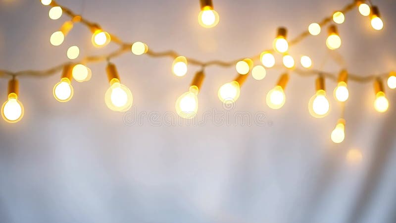 Softly Glowing String Lights on a Pale Background Create a Warm ...