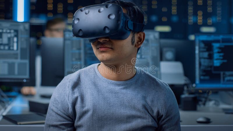 Software Delevoper Wearing Virtual Reality Headset Using Controllers To ...