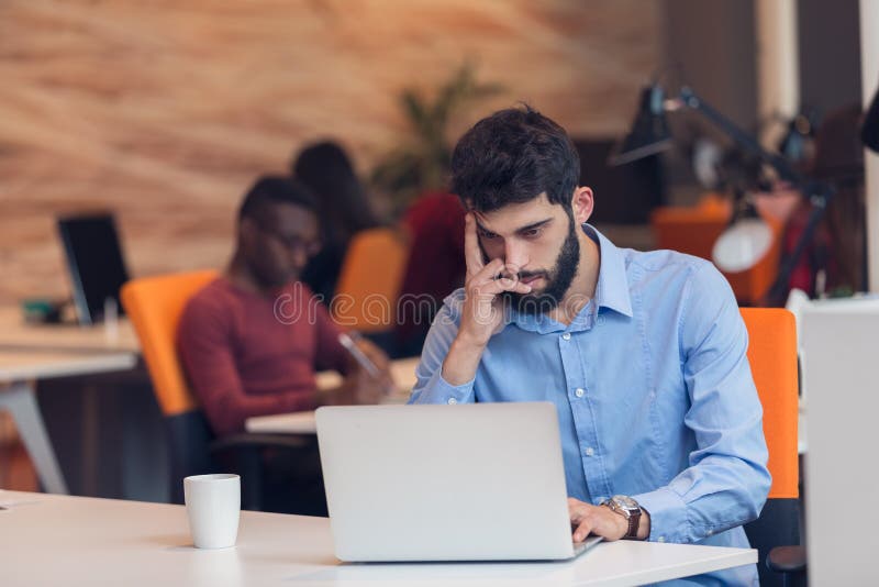 Software Developer Sitting with Laptop Computer in Startup Office Stock ...