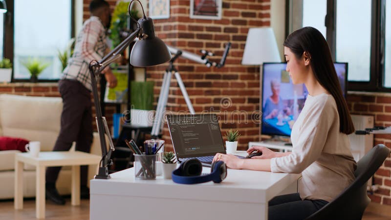 Software Developer Types Programming Code In A Cozy Home Office Setup 0504