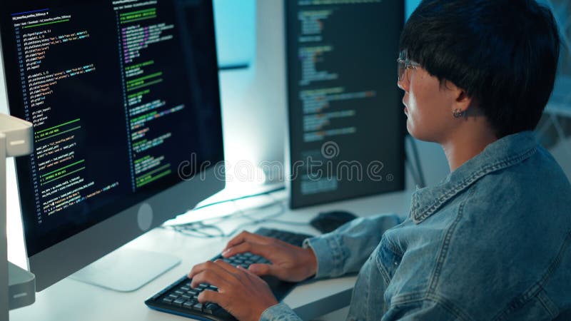 Software Developer Typing Code Debugging System on Multi Monitor Setup for Programming and ...