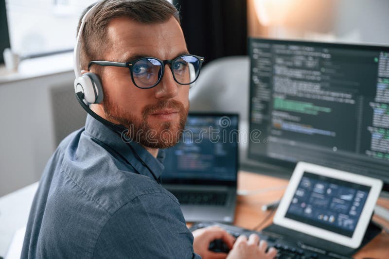 Software Developer is Sitting and Posing. Man in Formal Clothes is ...