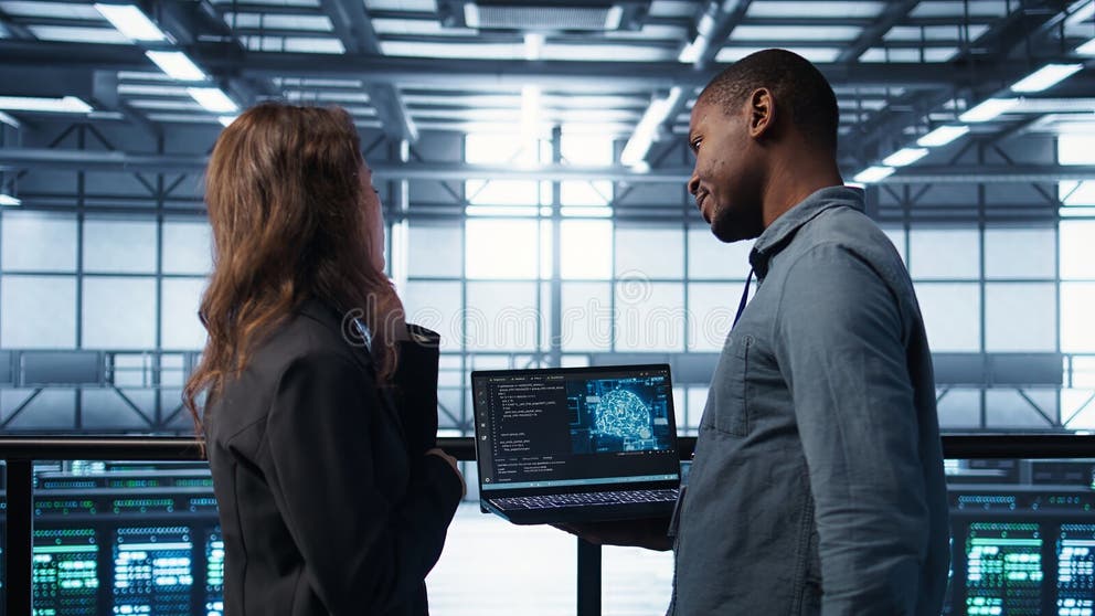 Software Developers in Data Center Using Laptop, Employing AI Machine ...