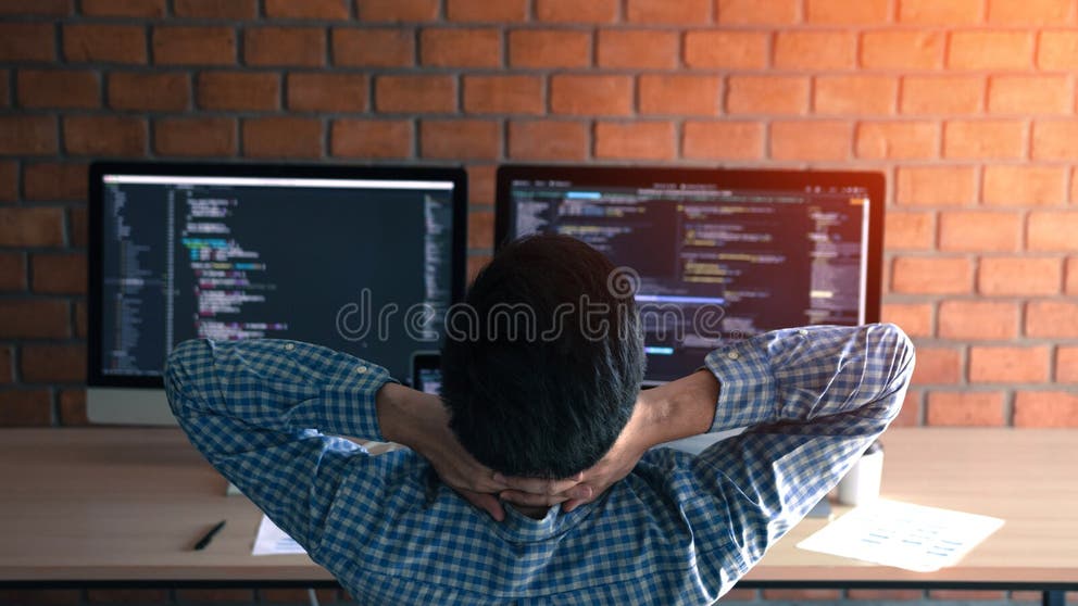 Software Developers are Relaxing from the Hard Work at His Office Stock ...