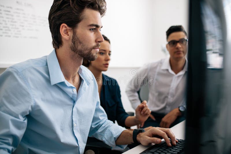 Application Developers Working on Computers in Office Stock Photo ...