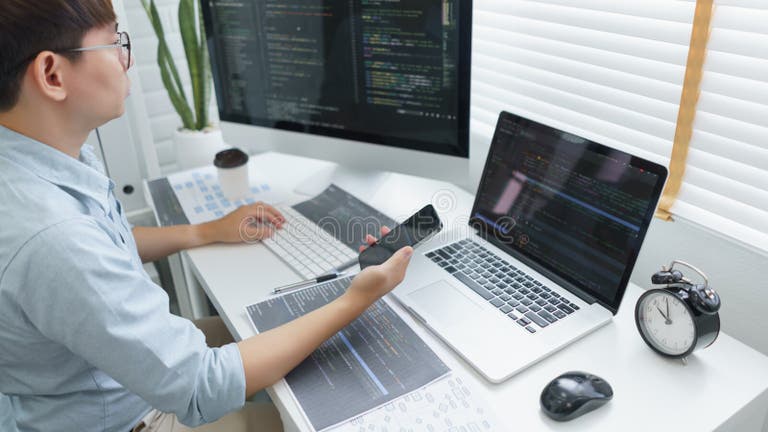 Software Development Concept, Male Programmer Check Website Programming on Smartphone and ...