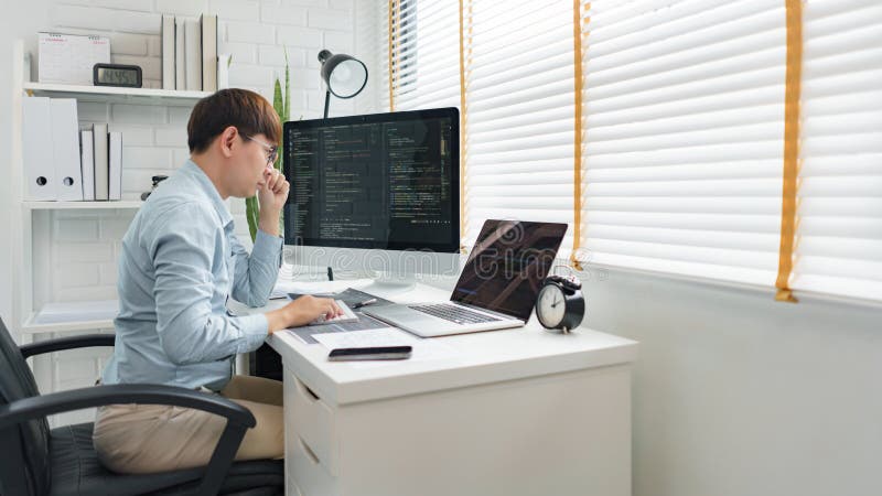 Software Development Concept, Male Programmer Looking Data on Laptop ... Software Development Concept, Male Programmer Looking Data on Laptop ...