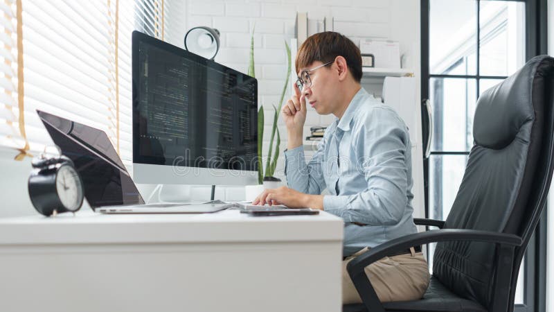 Software Development Concept, Male Programmer Looking Data on Laptop ... Software Development Concept, Male Programmer Looking Data on Laptop ...