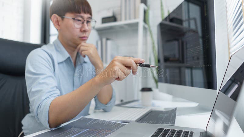 Software Development Concept, Male Programmer Pointing on Laptop Screen ... Software Development Concept, Male Programmer Pointing on Laptop Screen ...