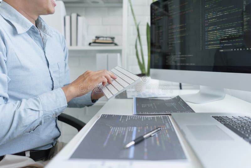 Software Development Concept, Male Programmer Looking Data on Laptop ... Software Development Concept, Male Programmer Looking Data on Laptop ...
