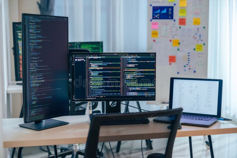 Software Development Office Workstation Setup with Multiple Monitors Displaying Code and ...