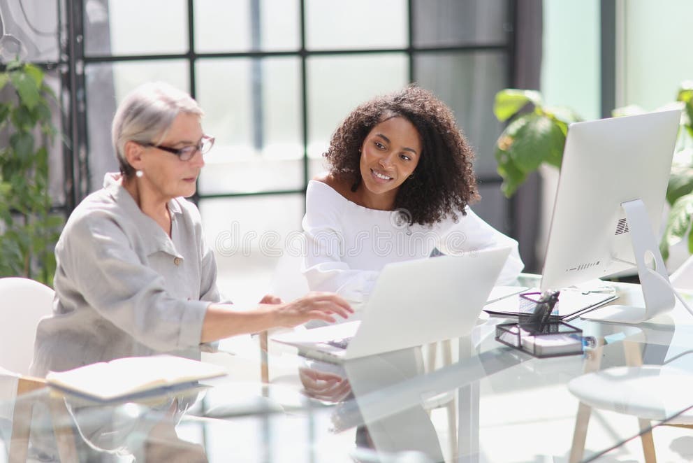 Software Development Team Discussing Algorithms On Computer Screen In