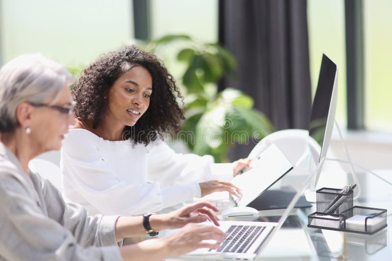 Software Development Team Discussing Algorithms On Computer Screen In