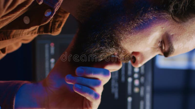 Software Engineer Puzzled In Front Of Computer Screen While Writing Complex Code Stock Video