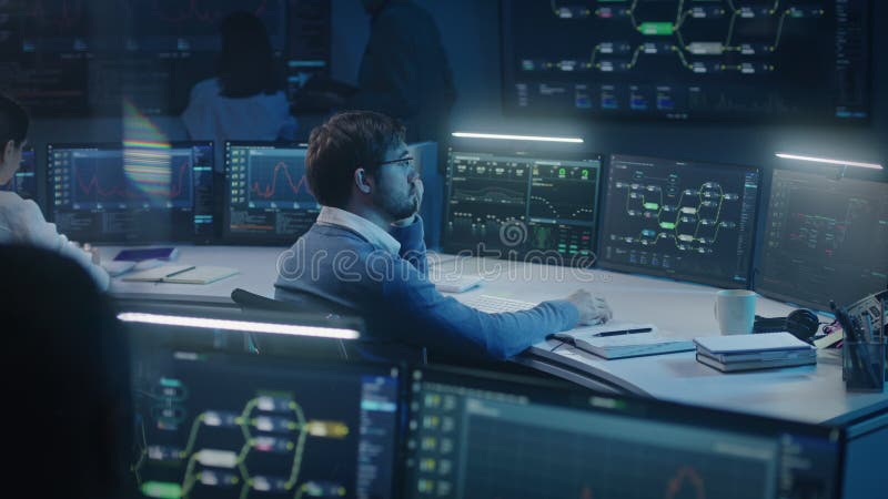 Engineer Works with a Robot in a Server Room, Close Up. Stock Video ...