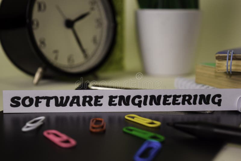 Software Engineering on the Paper Isolated on it Desk. Business and ...