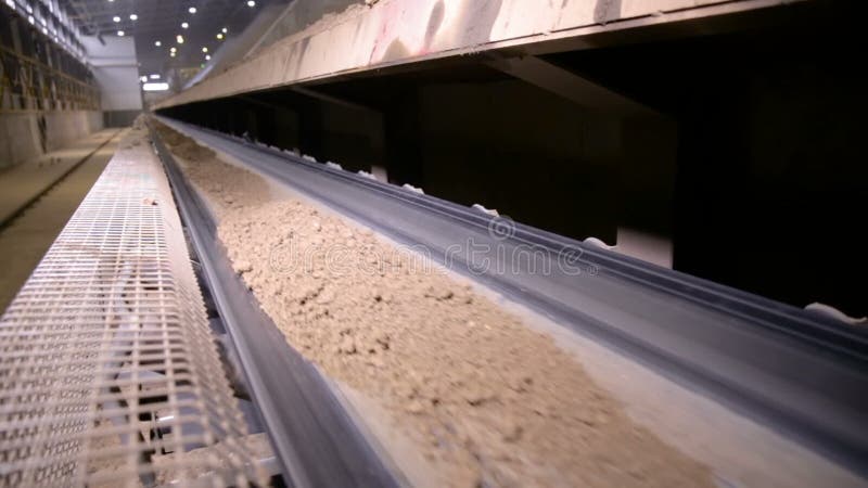 Conveyor with Soil. Clay Goes through Transporter in a Mining Factory ...