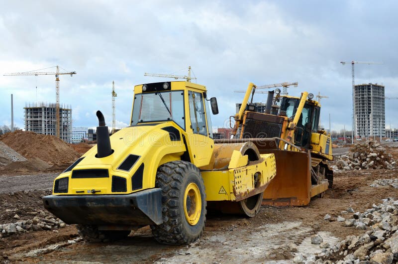 Soil Compactor and Bulldozer at Construction Site Stock Photo - Image ...