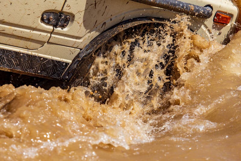 Soil and Dirt Flies Out from Under the Wheels of a Car Stock Image ...
