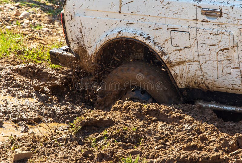 Soil and Dirt Flies Out from Under the Wheels of a Car Stock Image ...
