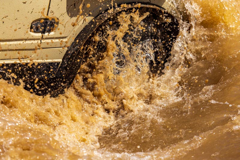 Soil and Dirt Flies Out from Under the Wheels of a Car Stock Image ...