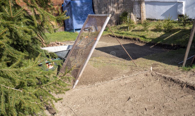 Soil is Sifted through at a Construction Site in the Garden Stock ...