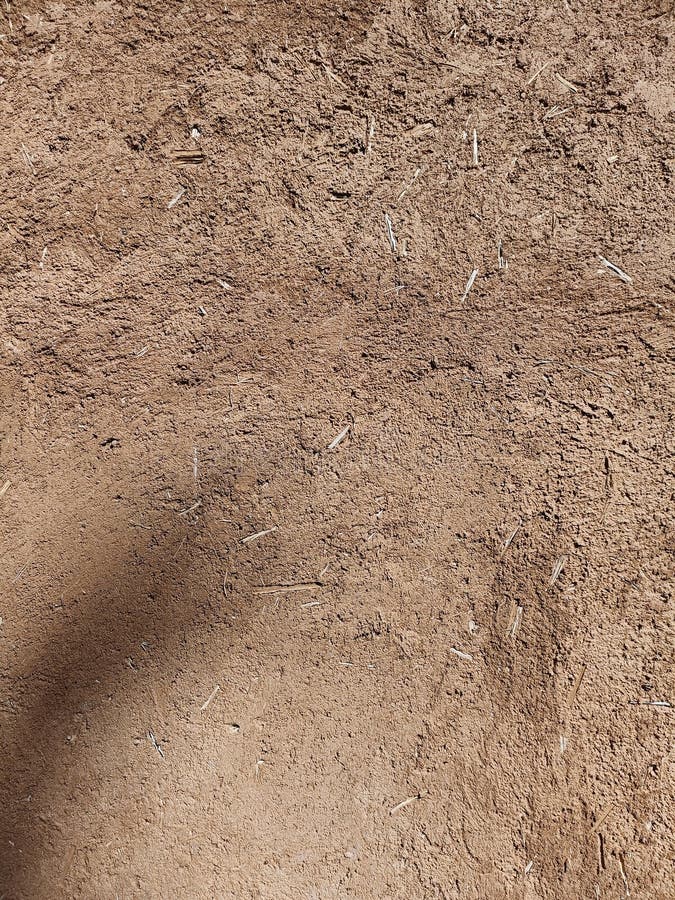 Soil Wall Texture of Adobe House Structure and Sunlight. Mud Background ...