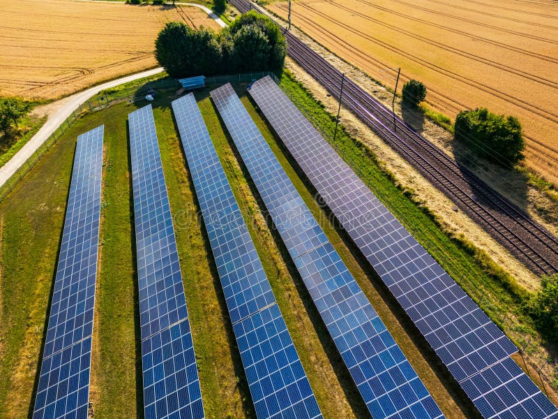 Solar Array Field with Solar Modules in the Countryside Next To a ...