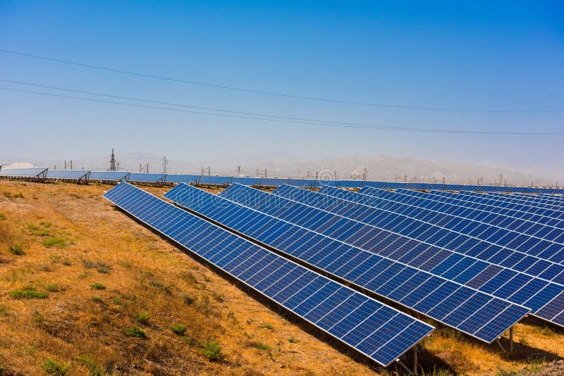 Solar Batteries Power Station Located in a Field. Stock Photo - Image ...