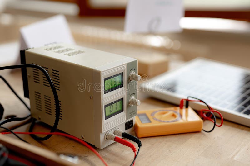 Solar Battery and Voltmeter on the Electrician S Desk. a Device for ...