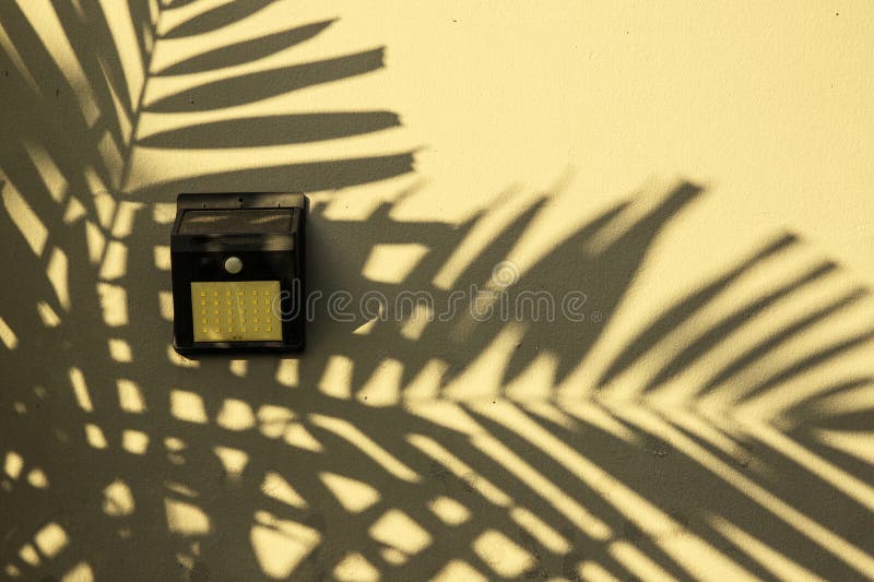Solar Cell Light on the Wall. a Small Solar Panel Mounted on an Outdoor ...