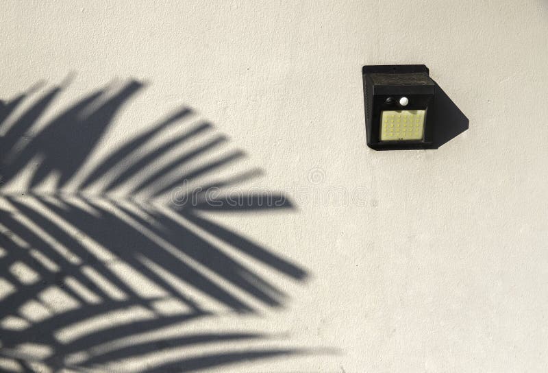 Solar Cell Light on the Wall. a Small Solar Panel Mounted on an Outdoor ...