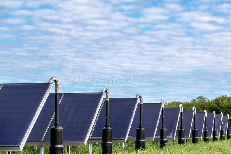 Solar collectors on field stock photo. Image of system - 100077302