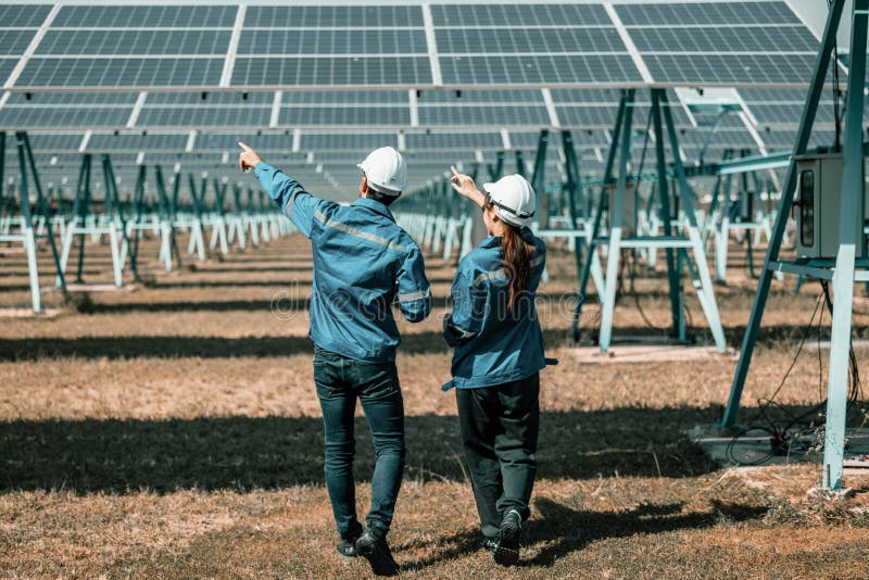 Solar Design Engineers Visually Inspect Photovoltaic Array Installation ...