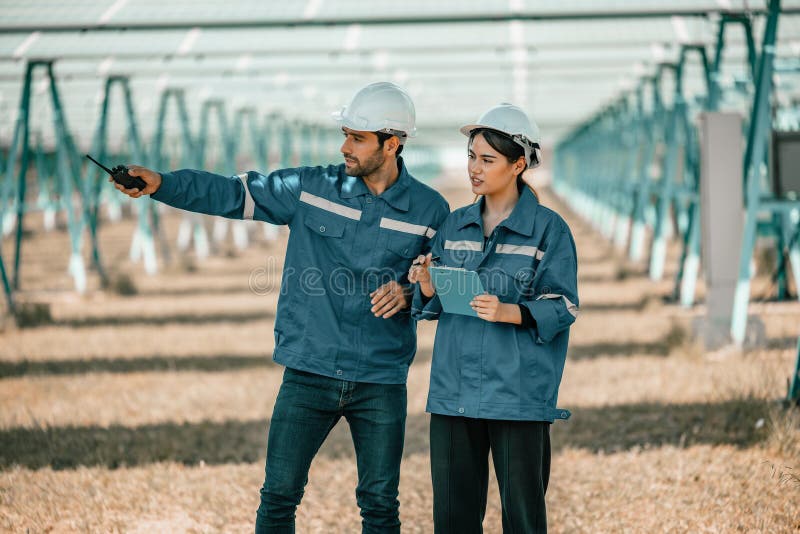 Solar Design Engineers Visually Inspect Photovoltaic Array Installation ...