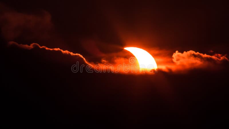 Solar Eclipse Behind the Clouds Stock Photo - Image of cloud, kearney ...
