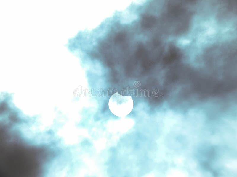 Solar Eclipse Behind the Clouds. Stock Image - Image of bright, lunar ...