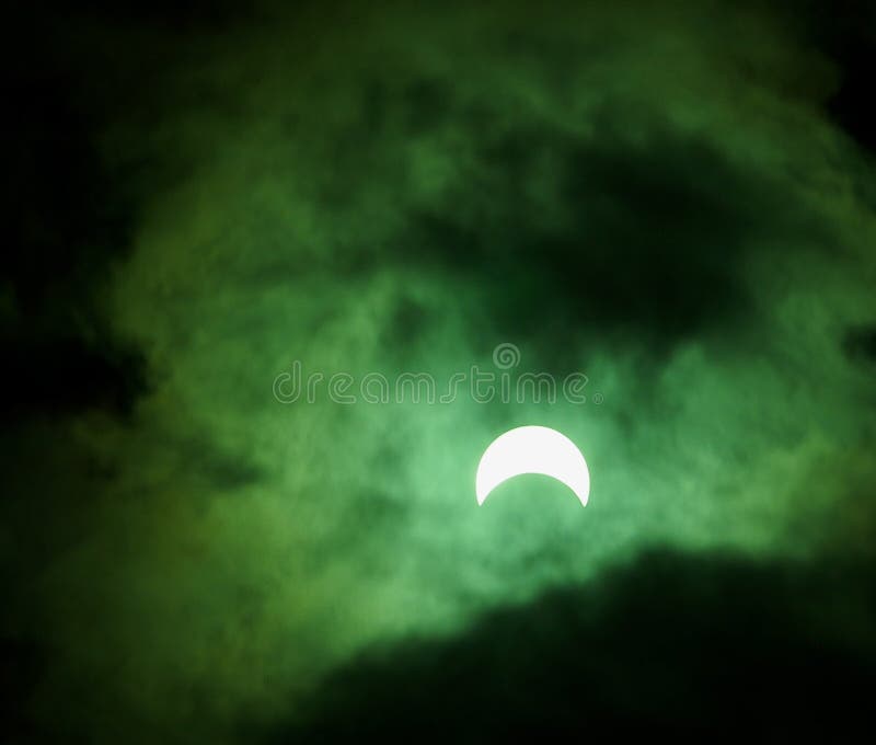 Solar Eclipse with Clouds stock image. Image of eclipse - 98747907