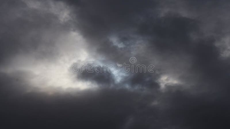 A Solar Eclipse in Cloudy Weather through a Cloud. Partial Solar ...