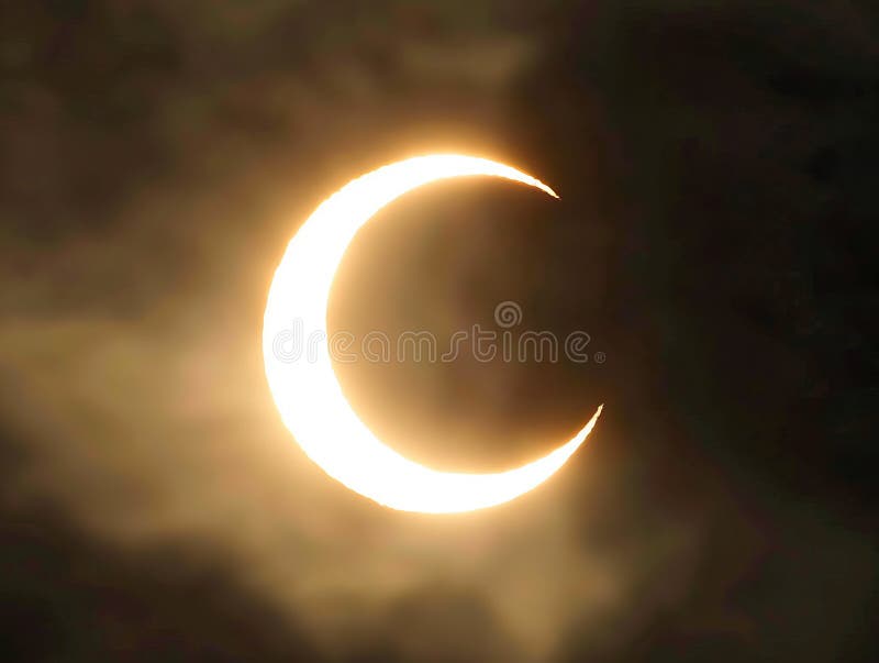 Solar Eclipse Creating a Radiant Crescent Viewed Against a Subtle ...