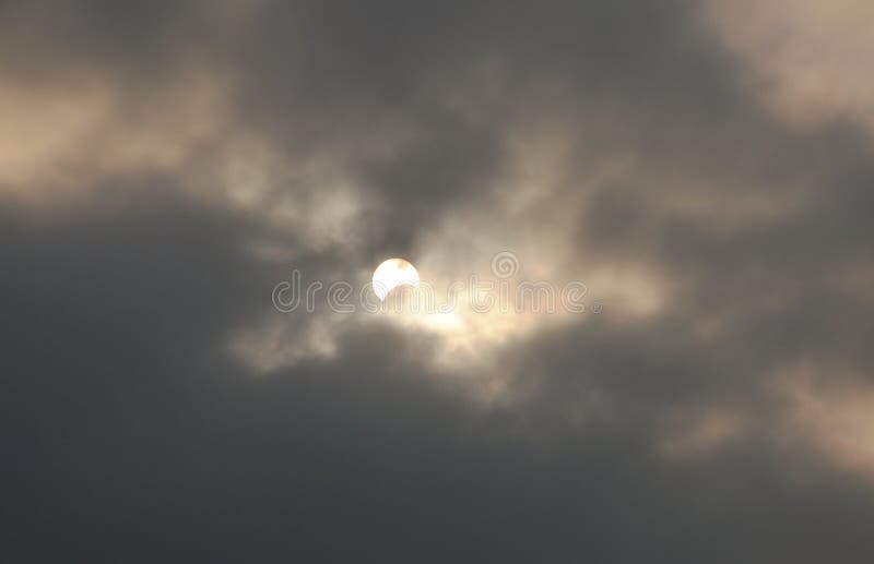 Solar eclipse in dull day stock photo. Image of space - 68045956
