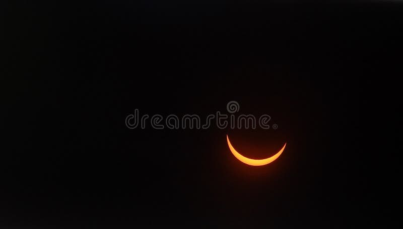Solar Eclipse with a Glowing Crescent in the Dark Sky Stock Image ...