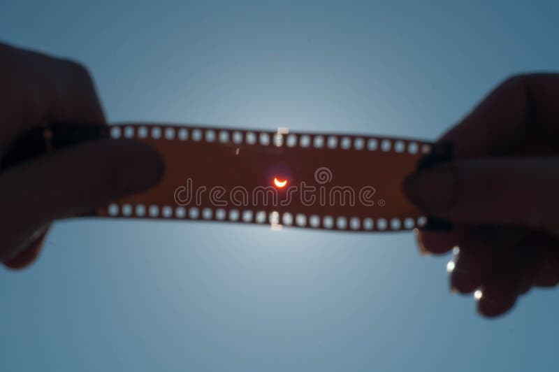 A Solar Eclipse, the Hand Holding Exposed Film, Stock Image - Image of ...