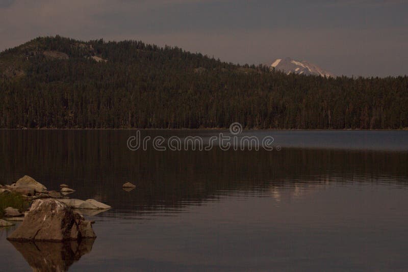 Solar Eclipse Makes it Seem Like Sunset on Alpine Lake in Mid Afternoon ...